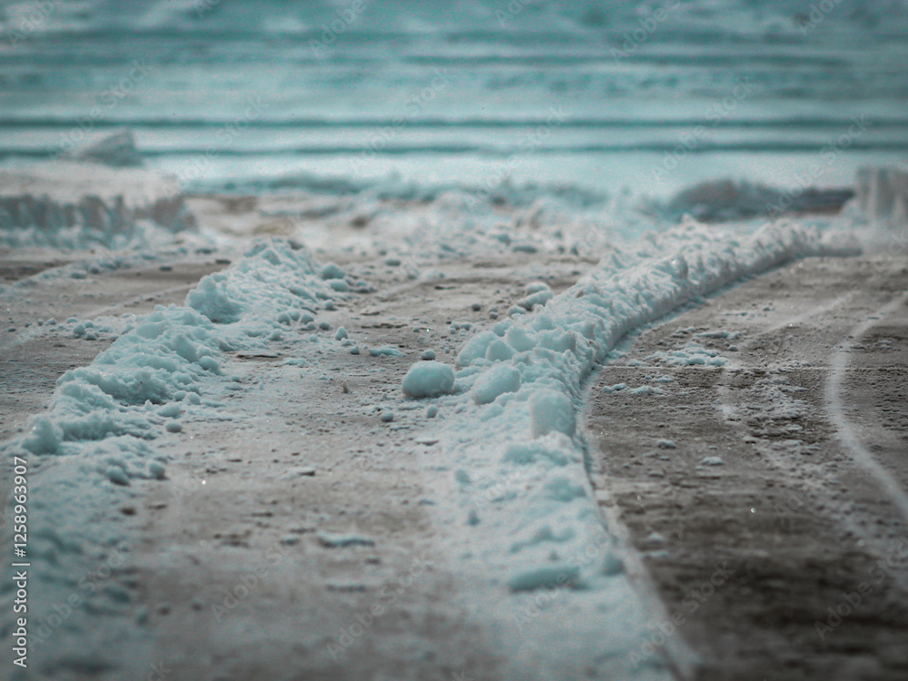 snow blower tracks in the driveway surface texture background. white ...