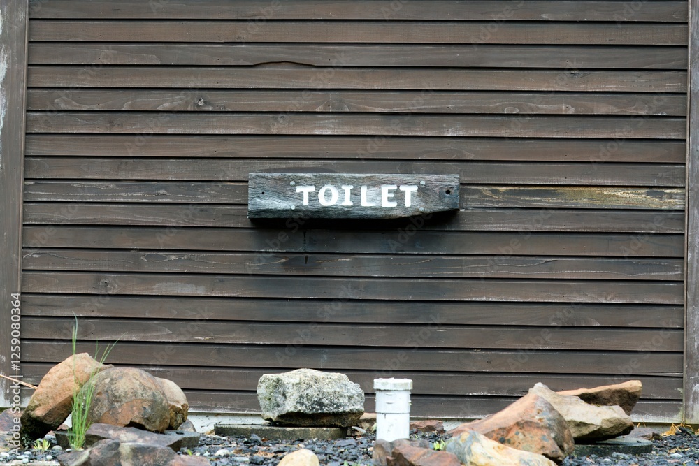 Toilet Sign on a Rustic Wood Board Wall – Vintage Restroom Indicator ...