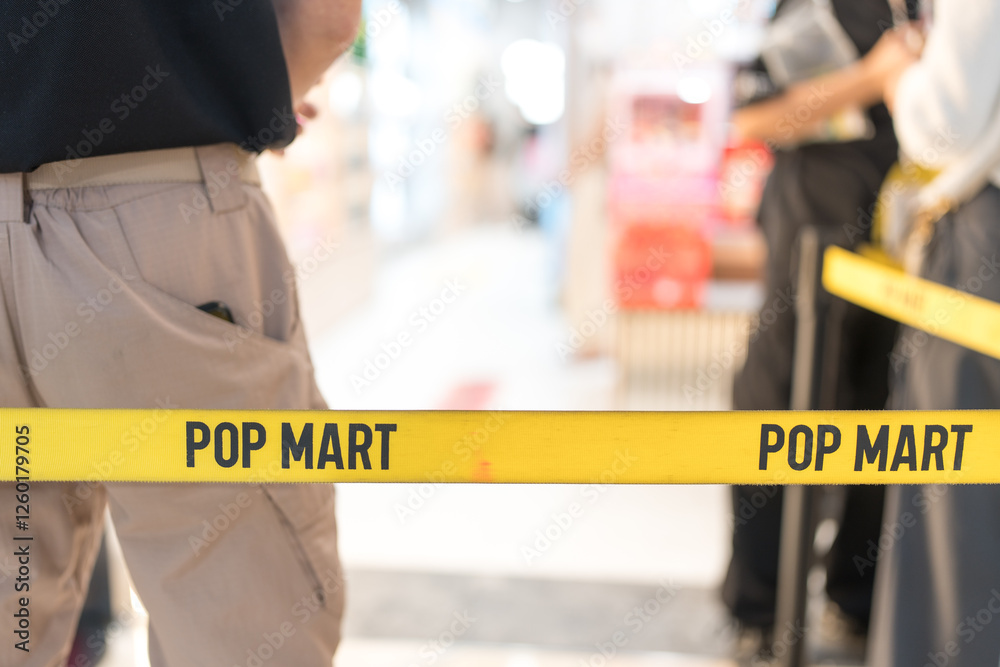 Bangkok, Thailand - February 12, 2025 : A barricade lines to queue up ...