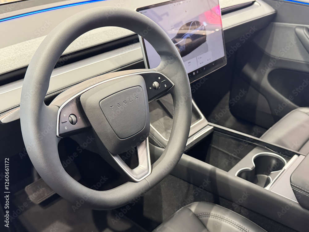 Shanghai,China-Feb.12th 2025: Tesla brand logo on steering wheel inside ...