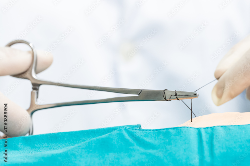 Stock-Foto „Doctor hand wear sterile gloves and surgery scissor ...
