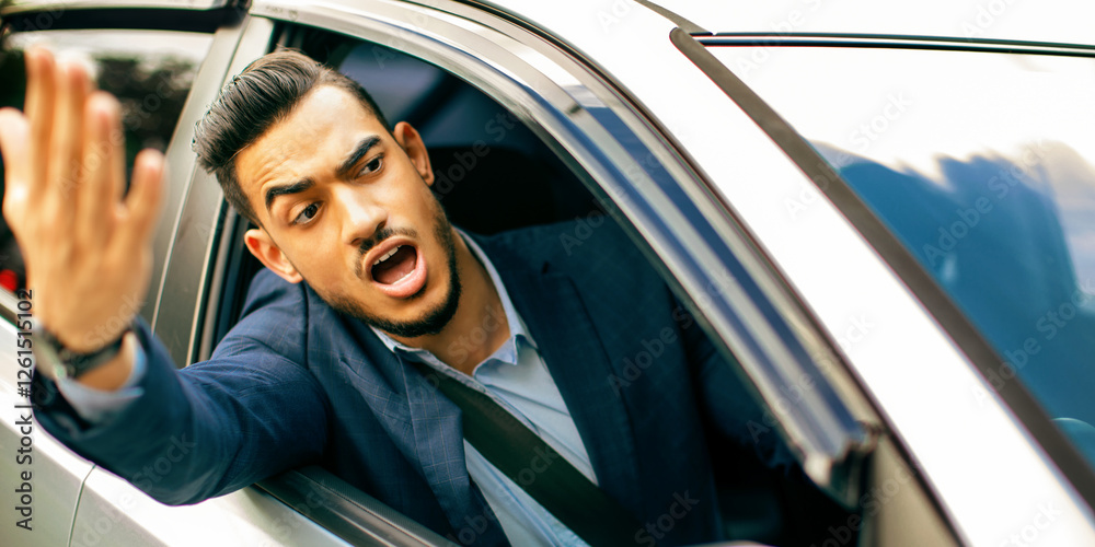 Furious middle-eastern businessman driving car, fighting with other ...