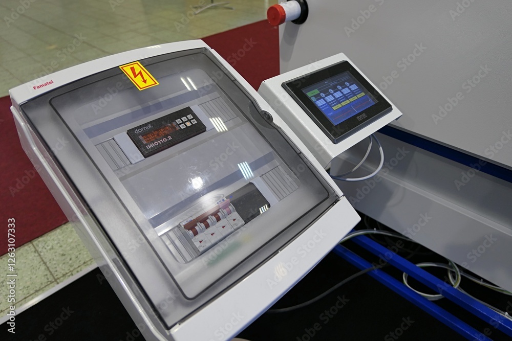 Detail of controls and fuse box of ceiling mounted circulation heating ...