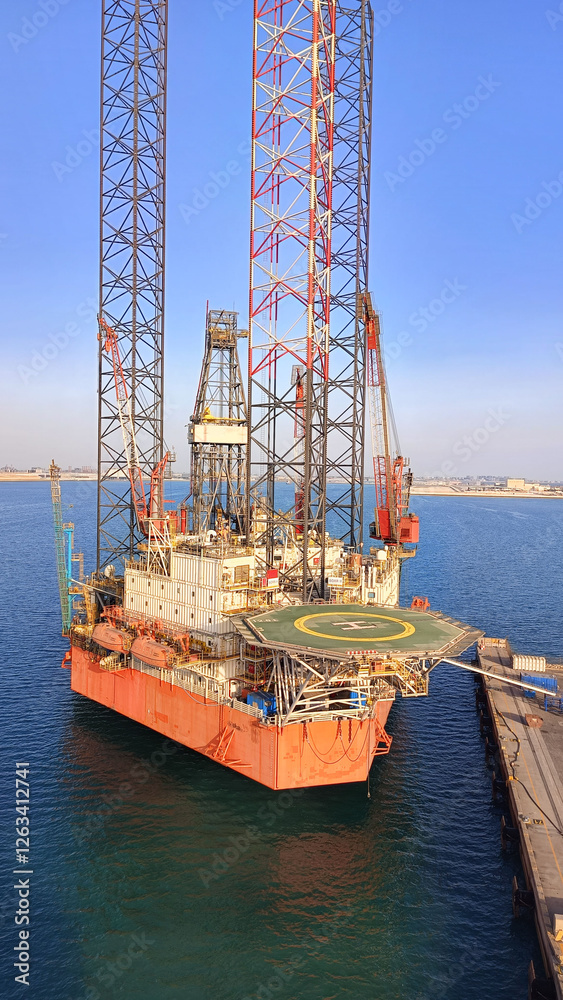 Oil platform in the Persian Gulf with a helipad and drilling rigs ...