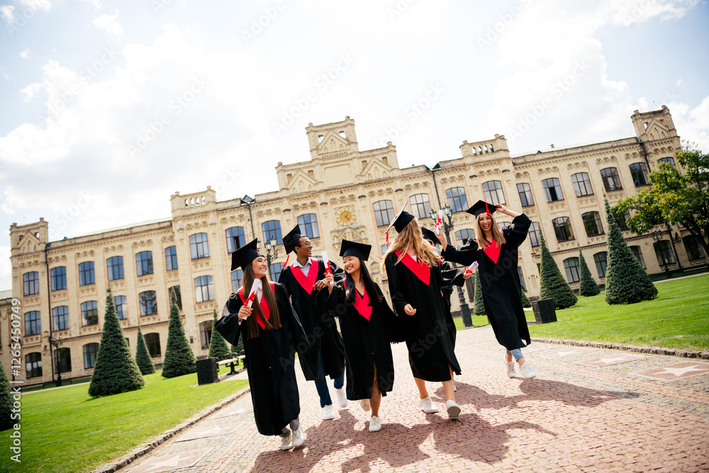 Full body portrait of group students mortarboard gown graduation ...