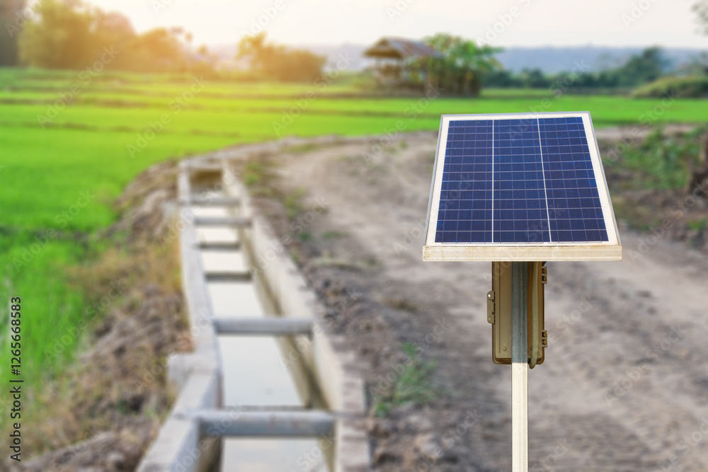 Solar panels installed along an irrigation canal, harnessing renewable ...