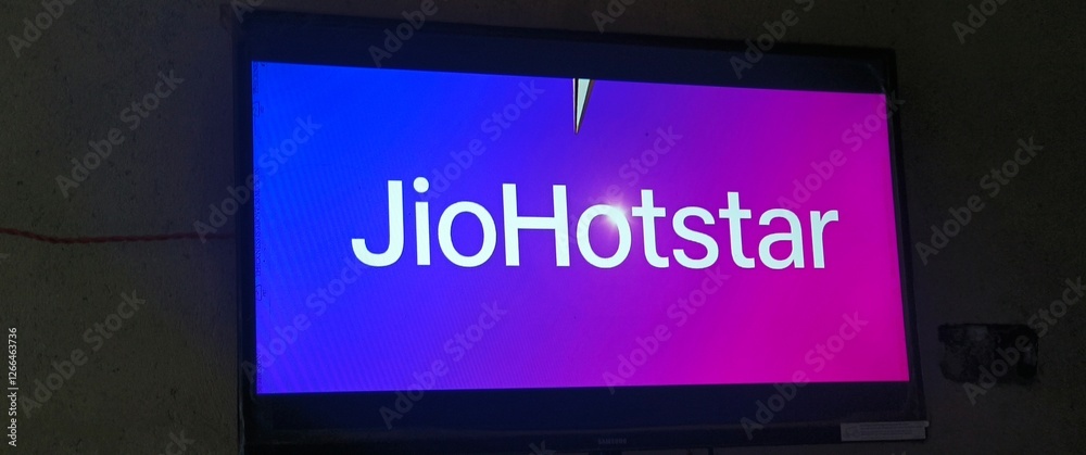 Foto de Stock New Delhi, India - February 15 2025. Jio hotstar app icon on LCD tv screen, a ...