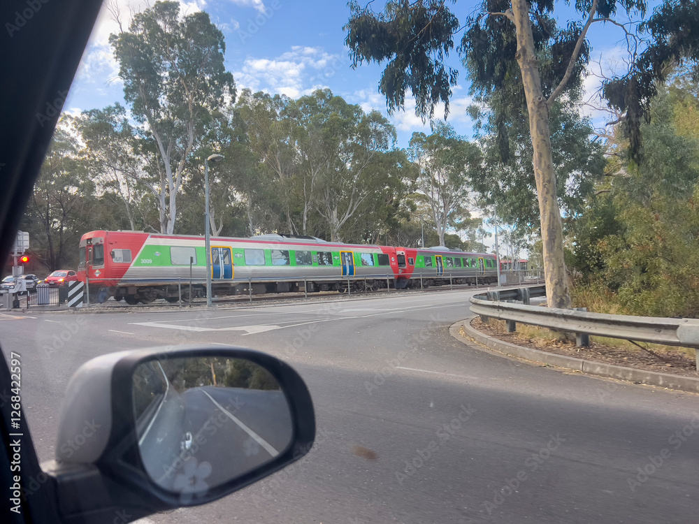 Adelaide Metro Train at a Railway Crossing: A Snapshot of Public ...