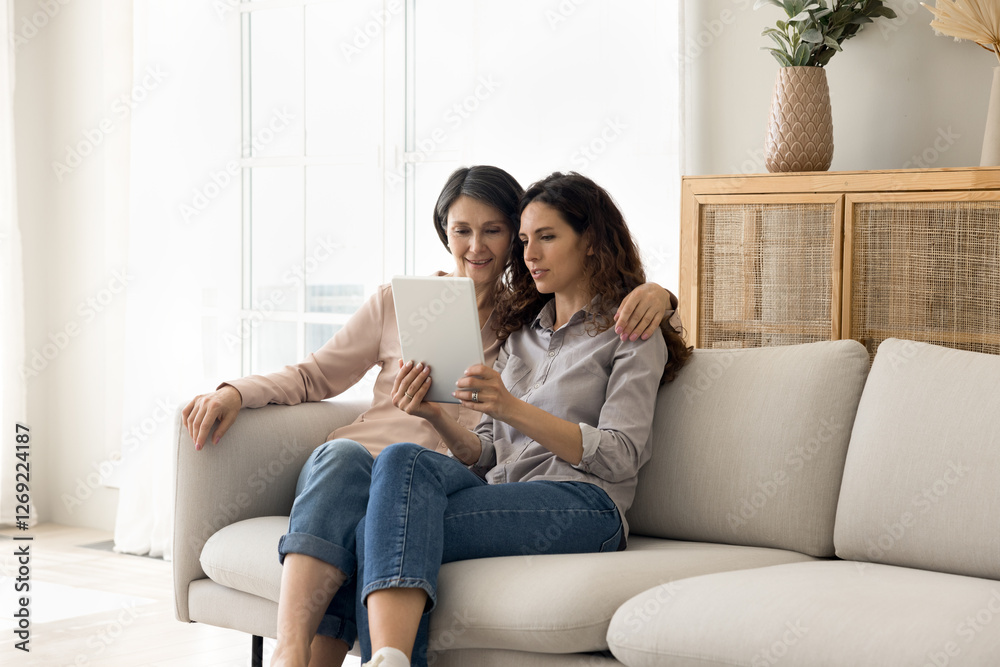 Sharing memories with beloved parent. Friendly family older age mom ...