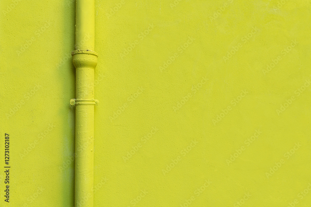 Yellow wall and a yellow downspout gutter. Photo suitable for ...