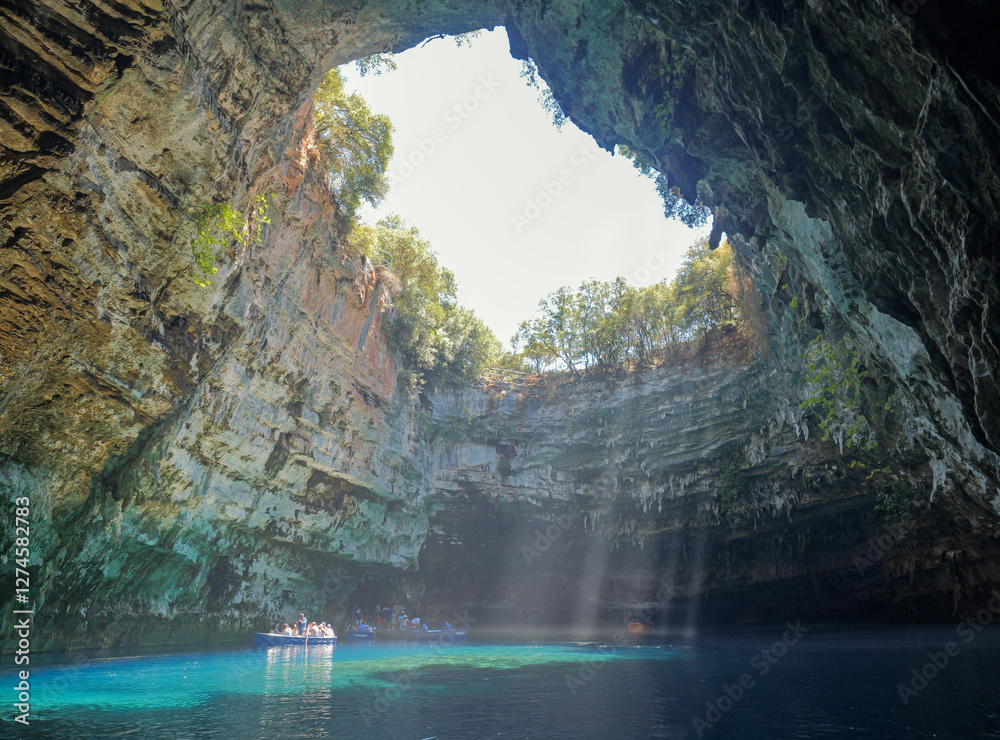 Kefalonia's Melissani Cave sun rays from roof coloring the lake in ...