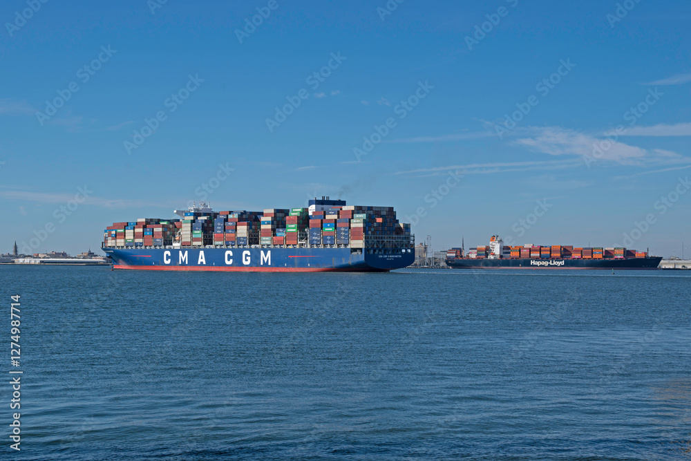 Container ship CMA CGM G Washington sails past moored Hapag-Lloyd Hudson Express in Charleston ...