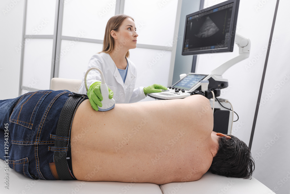 Ultrasound of kidneys. Man patient during ultrasound examination in ...