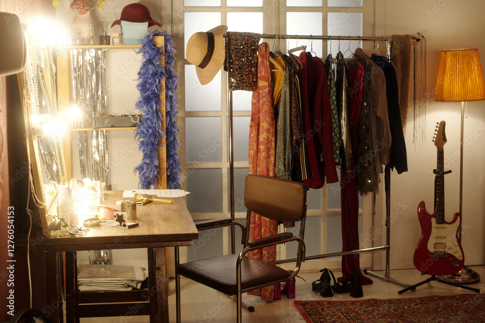 Fashion studio setup with dresses neatly hanging on a rack and a well ...