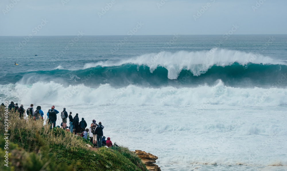 People enjoying huge Atlantic ocean waves during international surfers ...