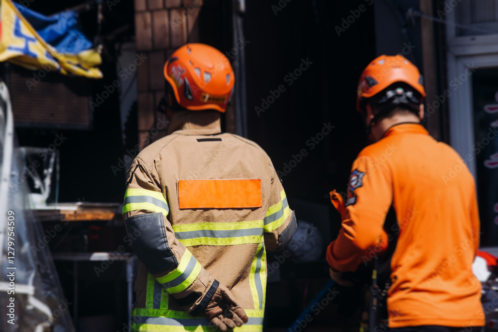 Group of South Korean fire men during fire fighting operation in the ...