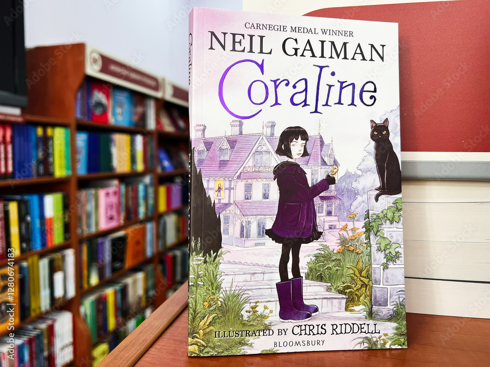 Bookstore display featuring the Coraline novel by Neil Gaiman with ...