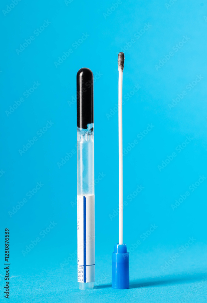 Sterile probe with a cotton swab for taking a nasal swab on a blue ...