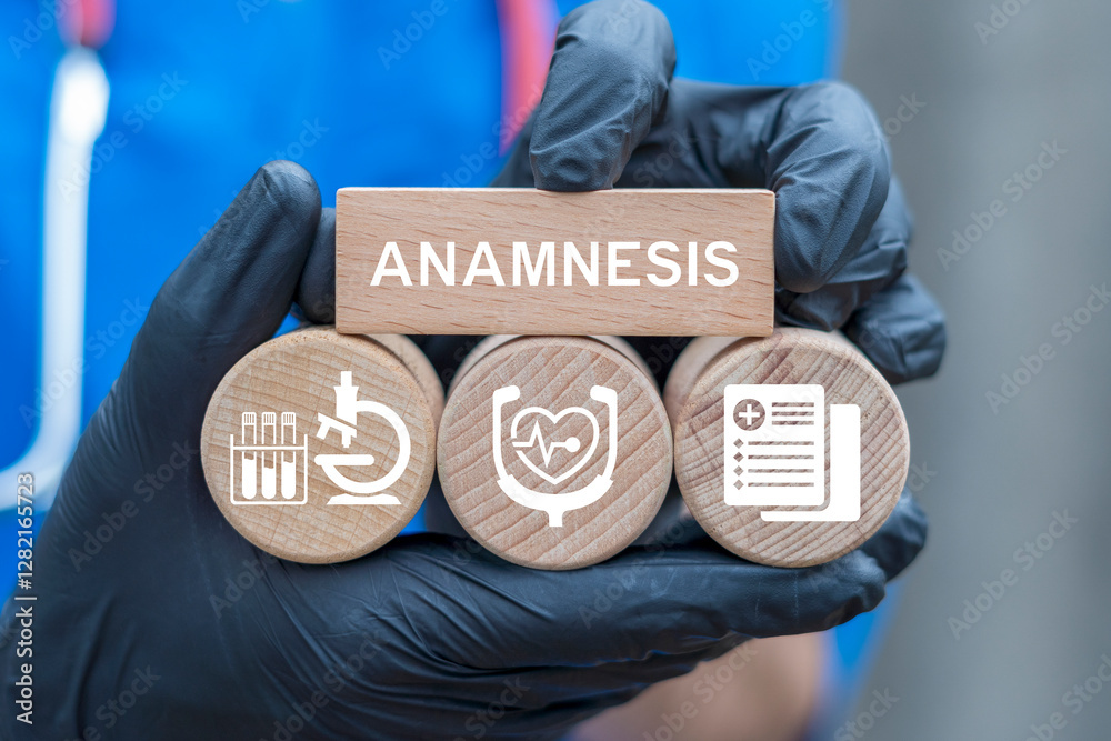 Doctor holding wooden blocks with icons sees word: ANAMNESIS. Patient ...