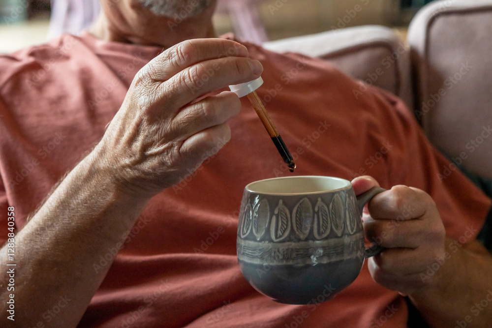 Microdose, Man with a dropper pipette taking the micro dose drug ...