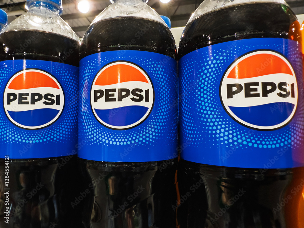 Bottles of Pepsi soft drinks displaying colorful labels and inviting ...