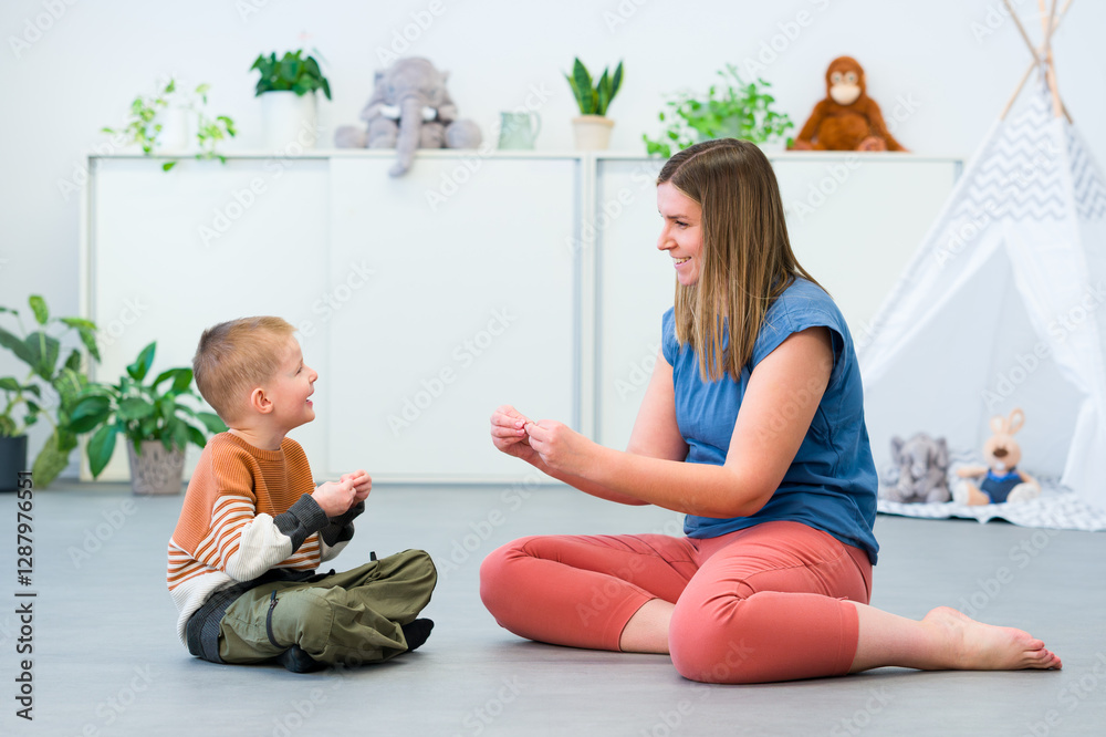 Baby Sign Language. Nonverbal child learning to sign with the help of a ...