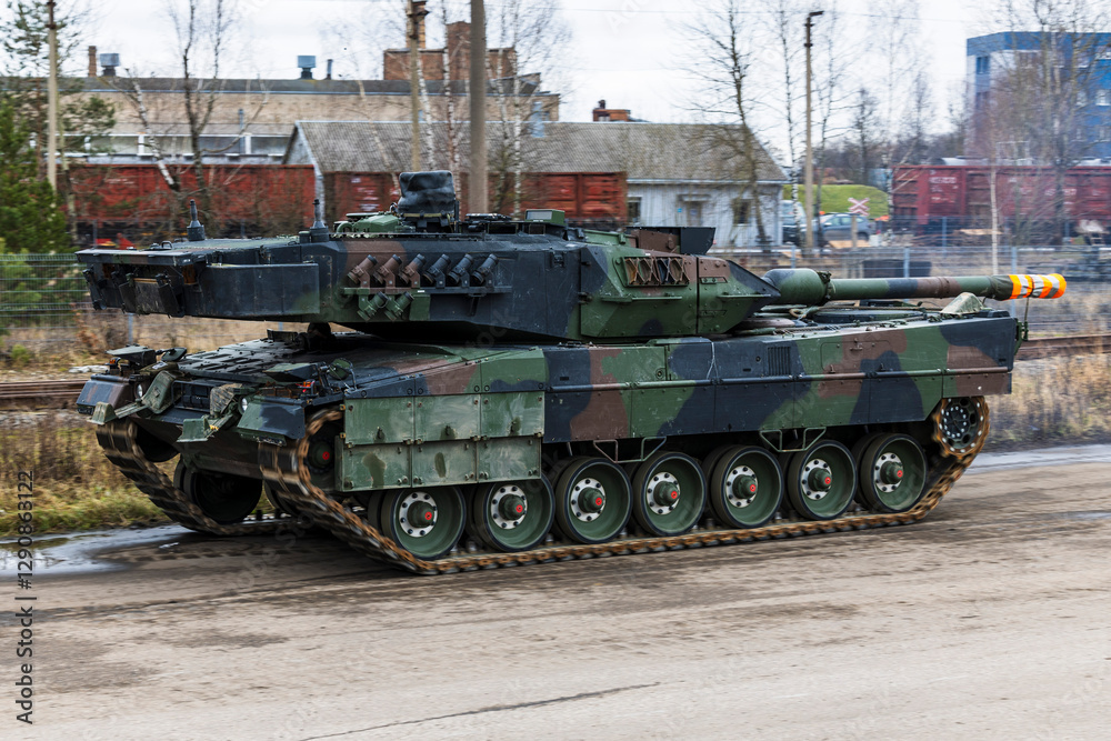 A rear view of a German Leopard 2 main battle tank loaded on a flatbed ...