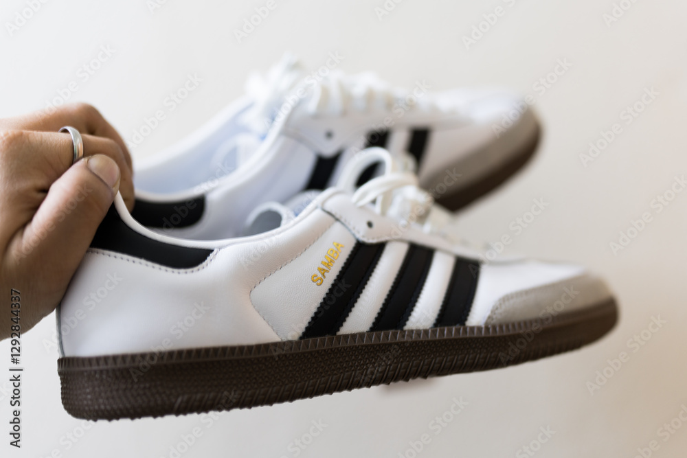 Bangkok, Thailand - February 26, 2025 : Hand holding shoes, Samba OG ...