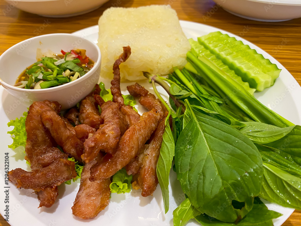 Thai sun dried, deep fried pork with sticky rice, stink beans, chili ...