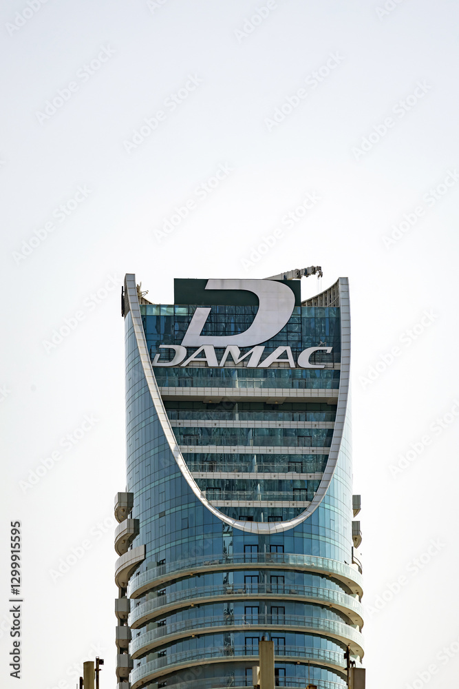 DAMAC Maison Distinction hotel tower. Damac development company logo on ...