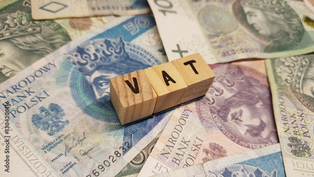Polish PLN banknotes and VAT inscription made of letter cubes. Value ...