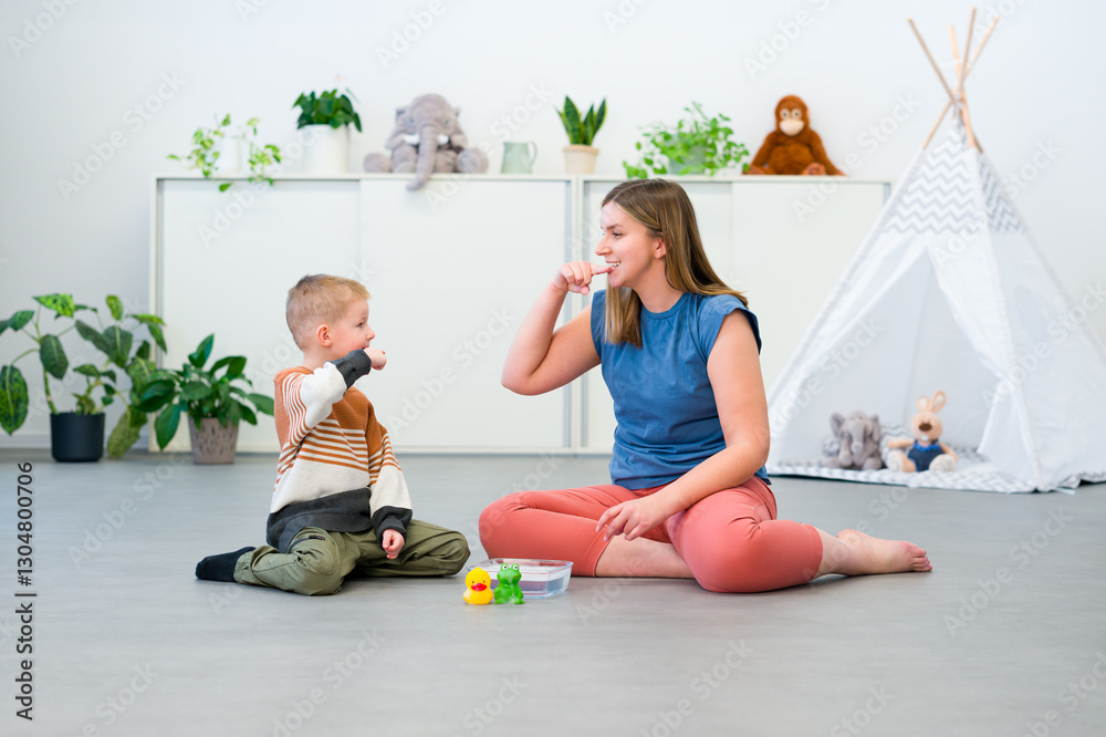 Baby Sign Language. Nonverbal child learning to sign with the help of a ...