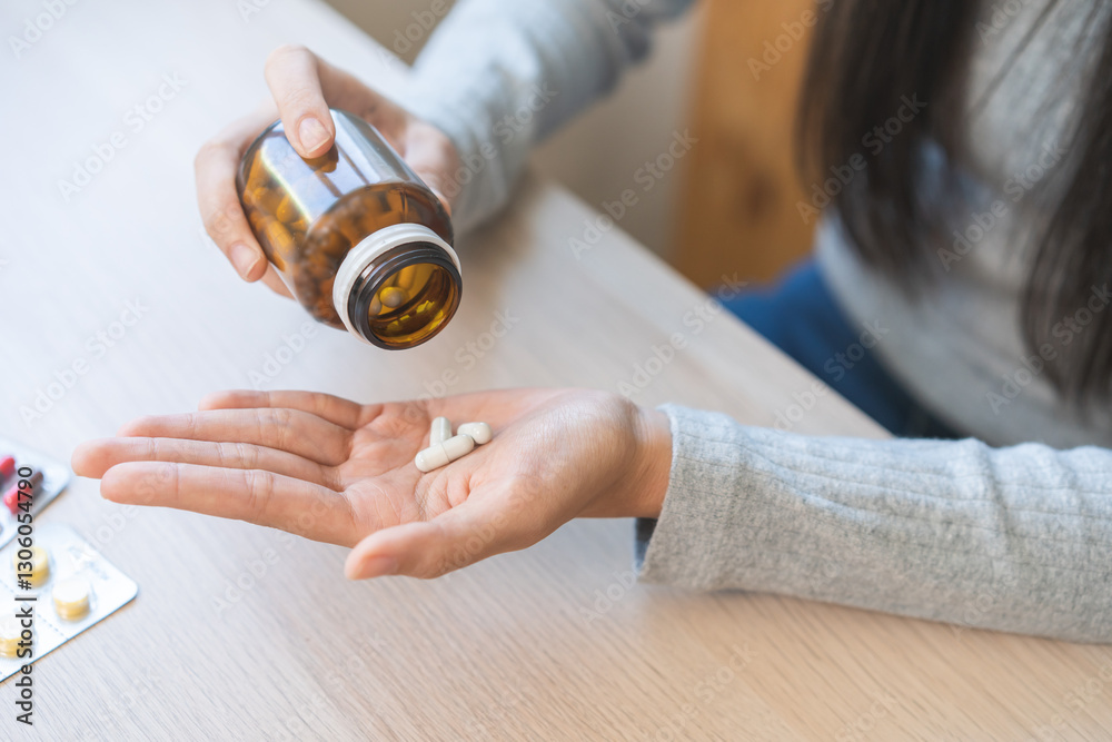 Sick ill asian young woman, girl hold tablet pill on hand pour capsule ...