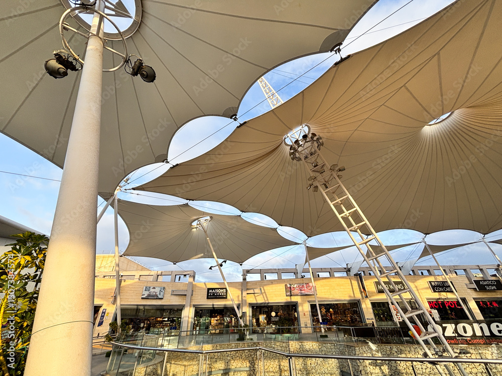 Modern architectural design featuring a unique canopy structure with a ...