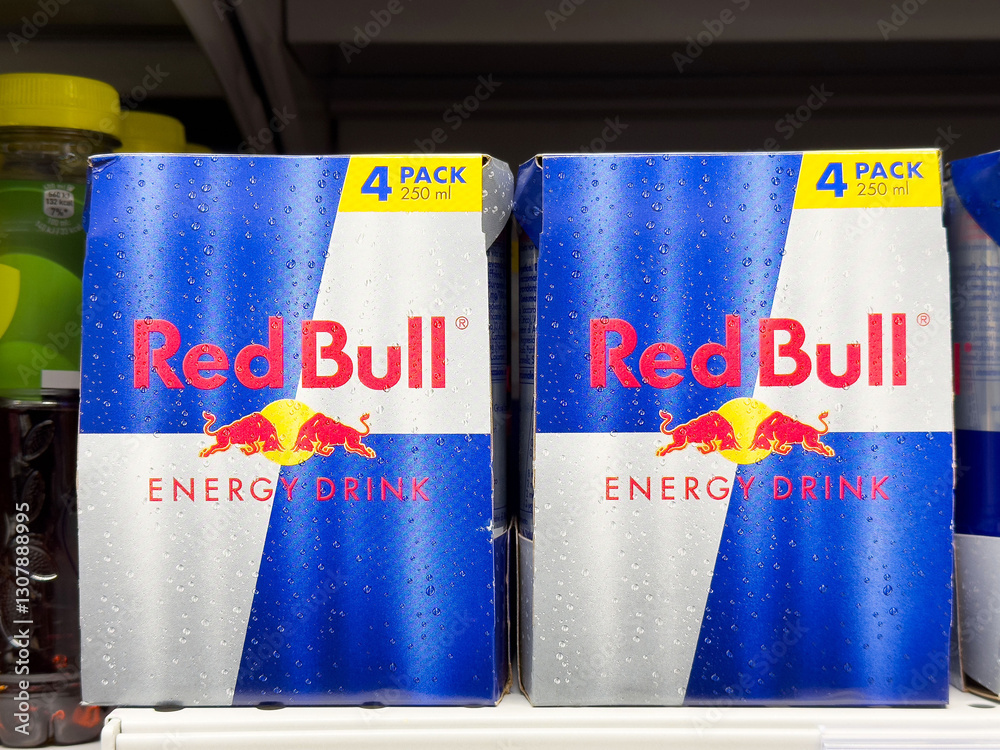 Four-pack red bull energy drink packages on supermarket shelf Stock ...