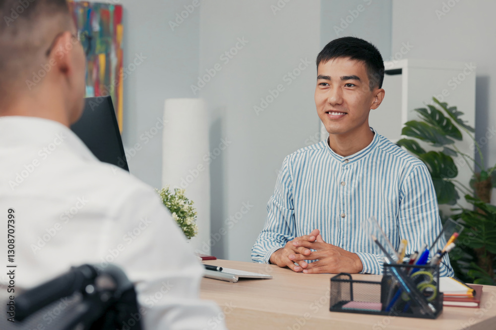Two men meet in company office morning for interview disabled boy ...