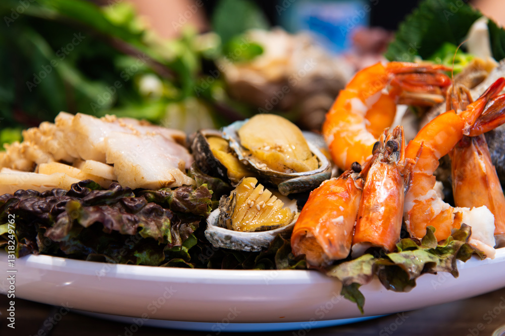 steamed abalone, prawn and boiled pork with other ingredients on the ...