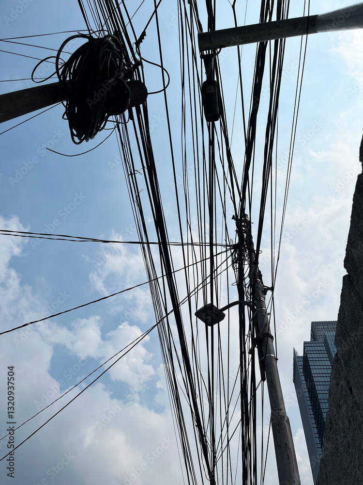 Electric pole and messy wires in Jakarta, Indonesia. Large steel ...