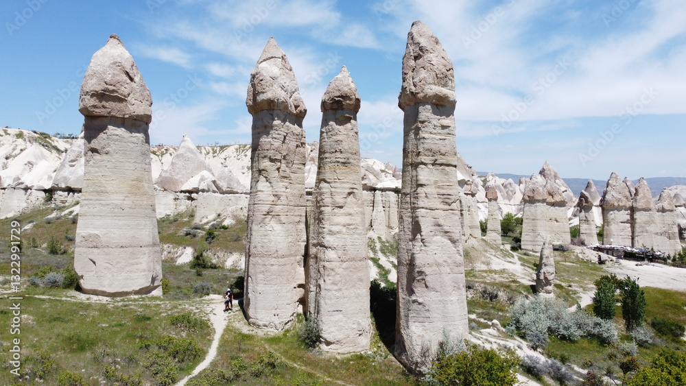 Tall, phallic-shaped rock formations rise from a valley in Cappadocia ...