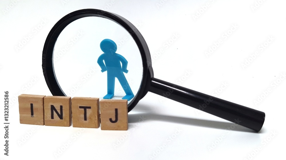 A photo of wooden blocks spelling "INTJ," with a small toy figure ...