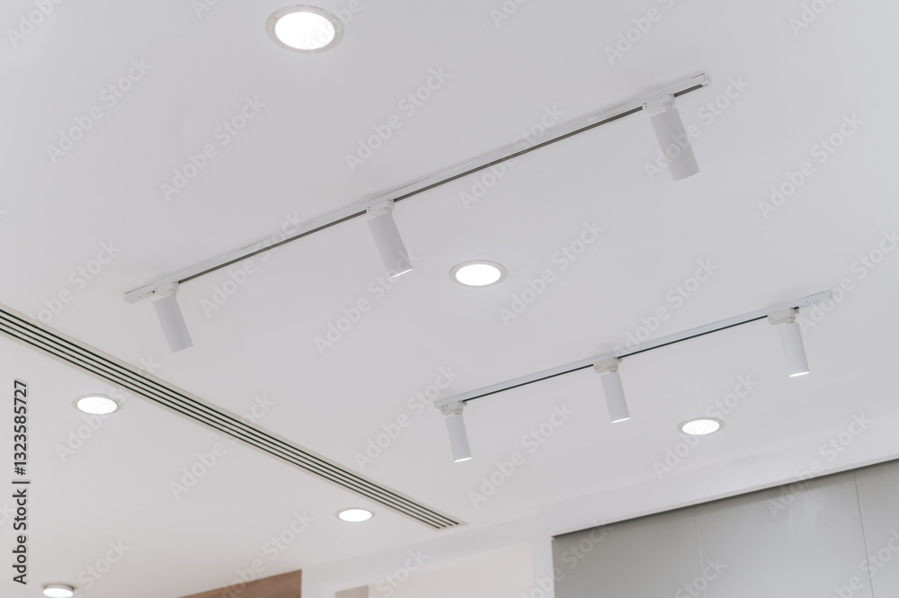 Modern ceiling with recessed lights and track lighting in clean, bright ...