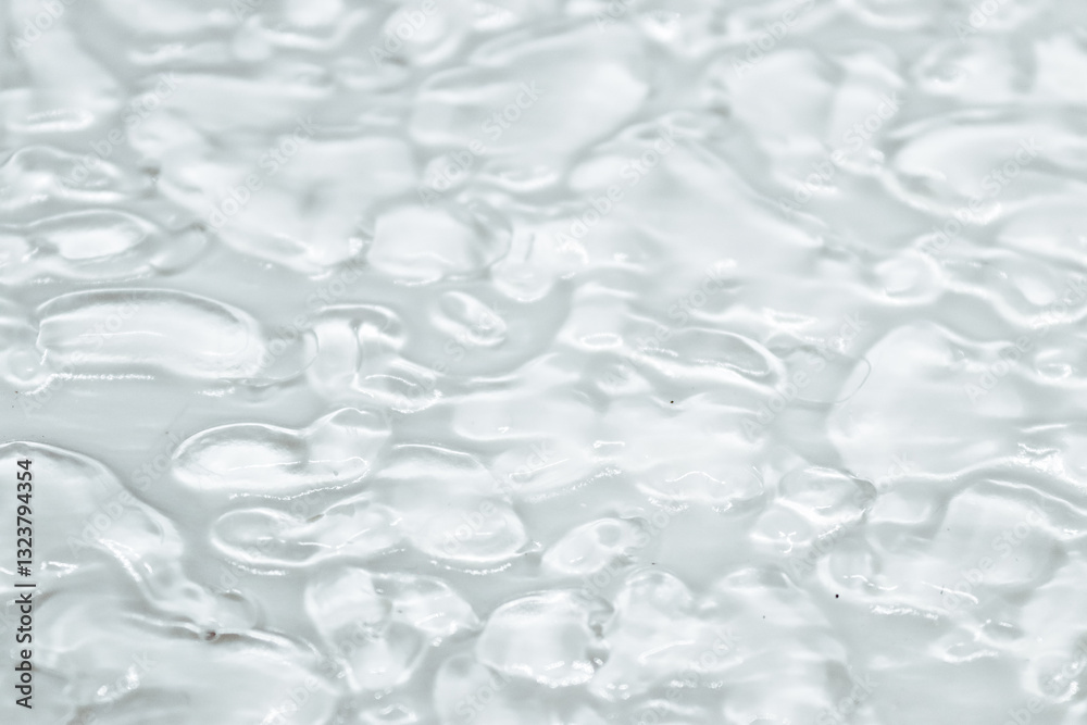 Textured glass with wavy patterns, creating a smooth, undulating ...