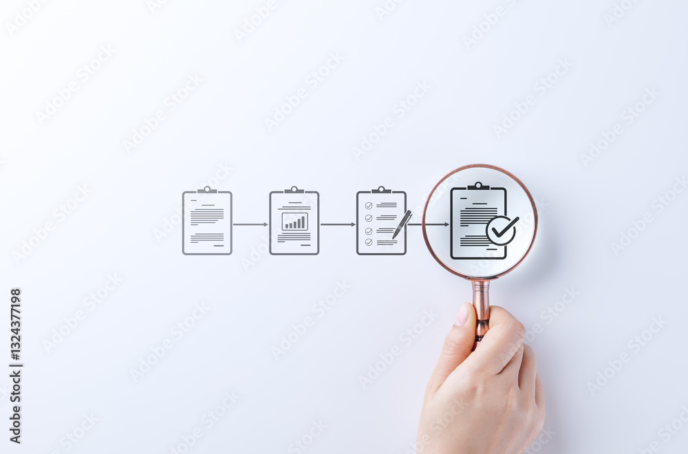 Document review and quality control process. A hand holding magnifying ...