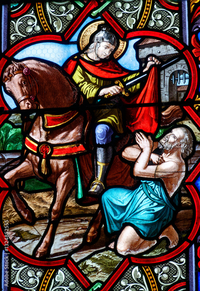 Stained glass (19th century) of Saint Martin of Tours cuting a piece of ...
