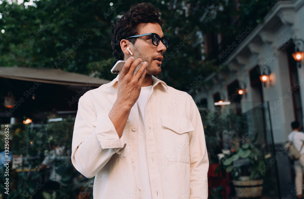 confident businessman uses voice input on smartphone while standing ...