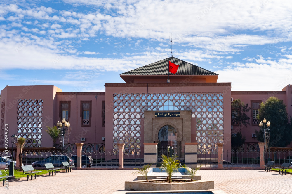 Marrakech-Safi region building, Moroccan flag waving,, african red city ...