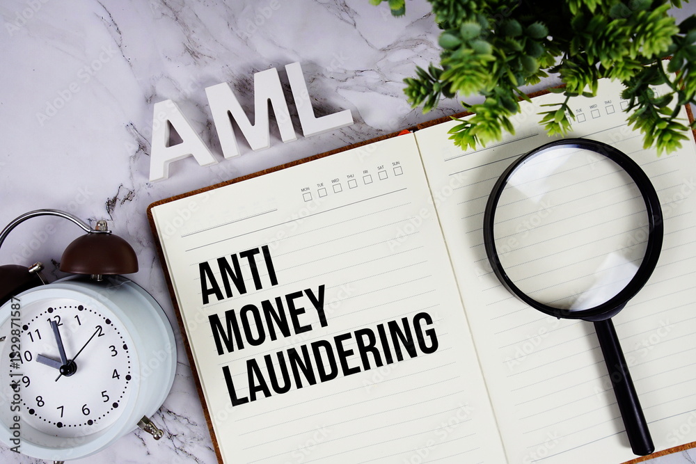 AML - Anti Money Laundering acronym on notepad, Business concept ...