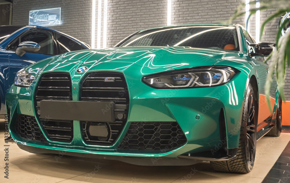 BMW M3 Competition G80 green color in showroom. Exterior BMW M3 G80 a ...