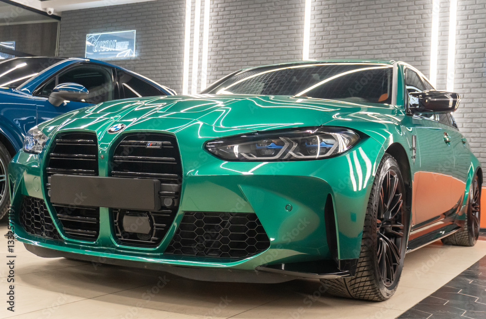 BMW M3 Competition G80 green color in showroom. Exterior BMW M3 G80 a ...
