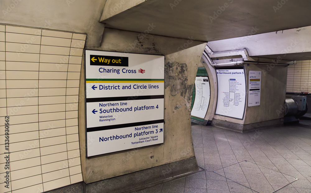 Navigating London Tube station with directional signs inside platform ...